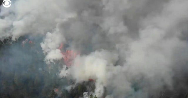 Firefighters in Virginia successfully contain wildfire - CBS News