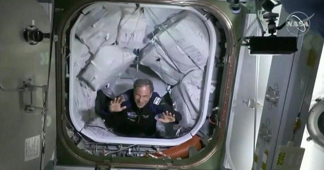 First private flight to ISS carries 3 men to station - CBS News