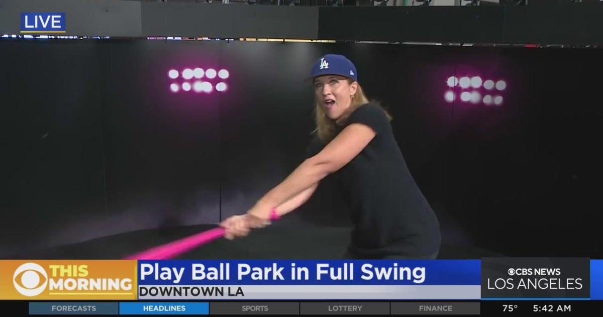 Kara Finnstrom drops the mic, and the bat, at the MLB Play Ball Park ...