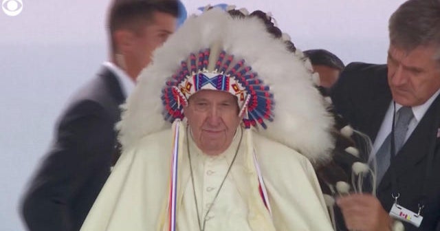 Indigenous leader places traditional headdress on Pope Francis - CBS News