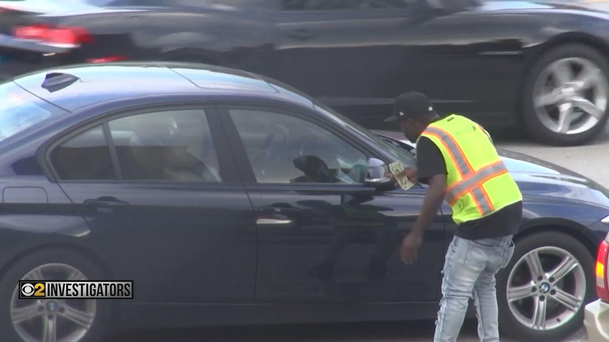 The Parking Scam: CBS 2 Investigators catch fake parking attendants ...