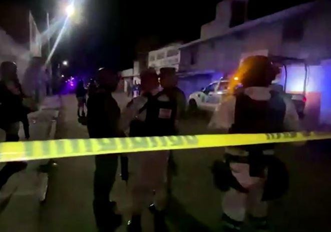 12 dead after gunmen open fire on customers and staff at bar in central ...