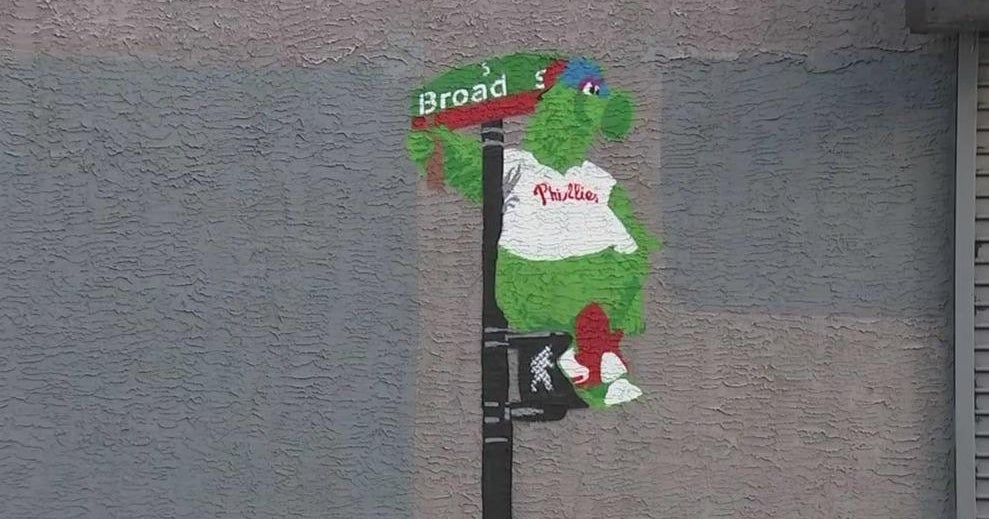 New mural shows Phillie Phanatic climbing greased pole - CBS Philadelphia