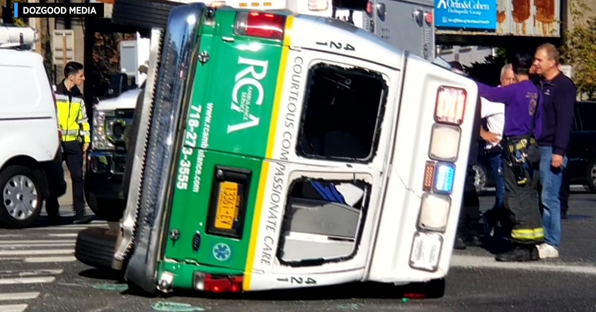 Ambulance overturns after being struck by van on Long Island - CBS New York