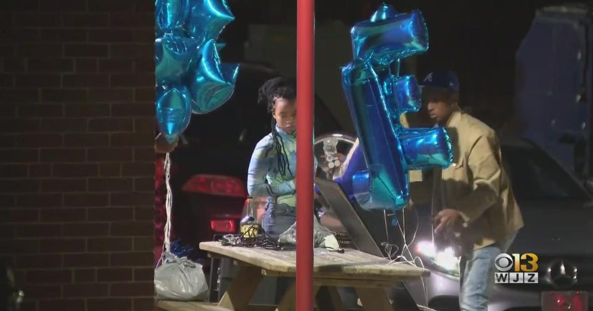 Family and friends of Parkville gunshot victim hold candlelight vigil ...