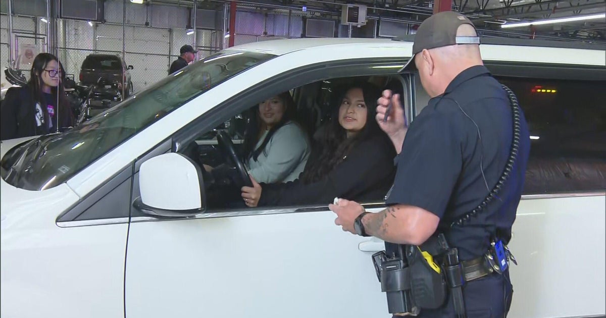 Denver police officers meet with students to discuss traffic safety ...