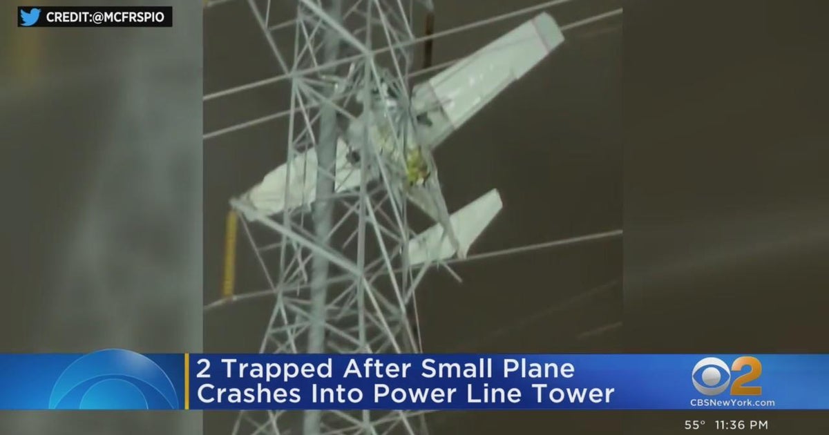2 trapped after small plane crashes into power line tower - CBS New York