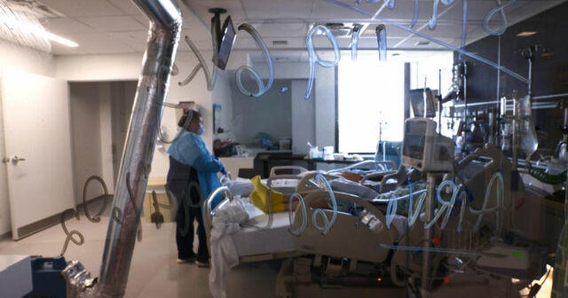 Hospitals overwhelmed as respiratory illnesses spike nationwide - CBS News