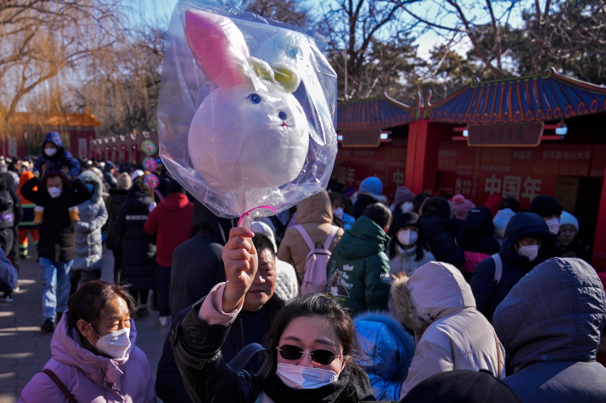 China's COVID surge cast a shadow over Lunar New Year travel rush, but ...