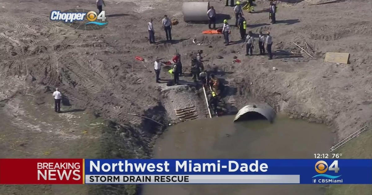 Construction diver rescue from drain pipe in NW Dade - CBS Miami