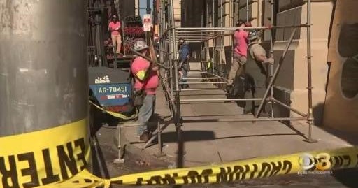 Woman fighting for her life after a part of a building broke off and ...