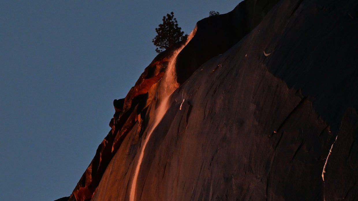 Setting sun creates Yosemite "firefall," making waterfall look like ...