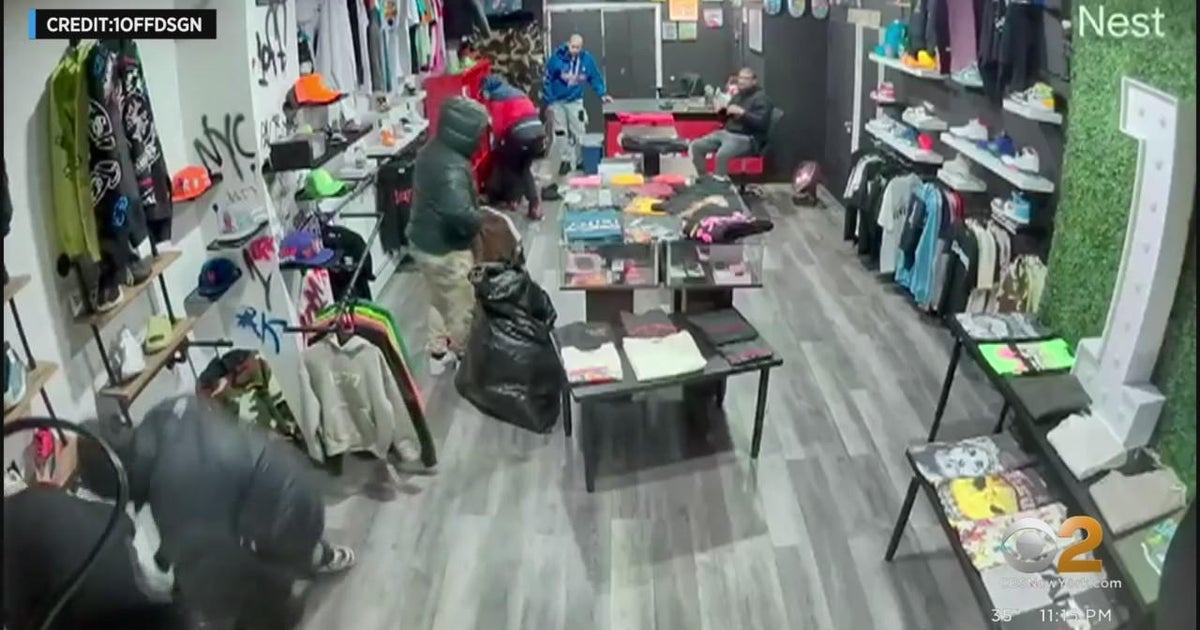 Exclusive: Video shows armed robbery at high-end Queens clothing store ...