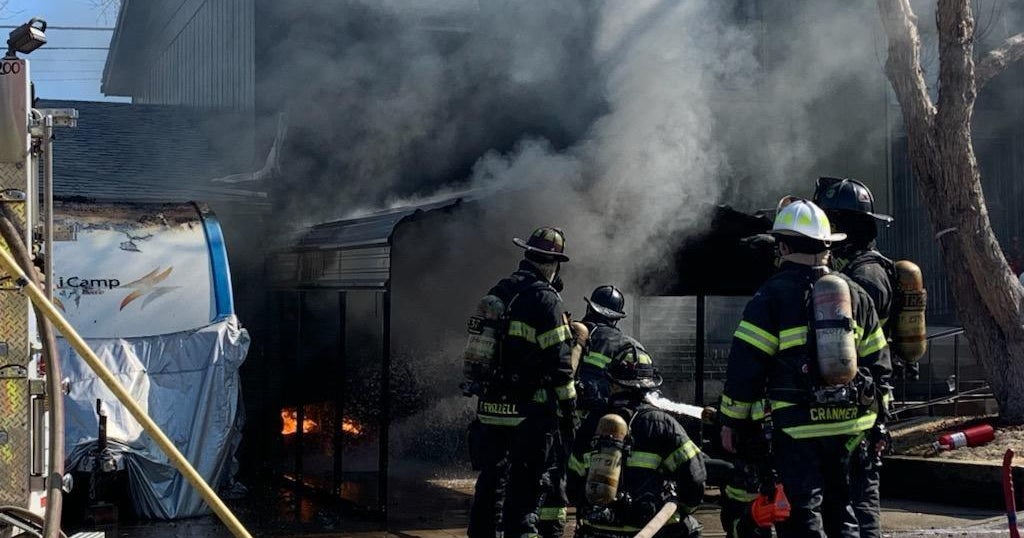 2 injured as firefighters rush to put out garage fire that spread to ...