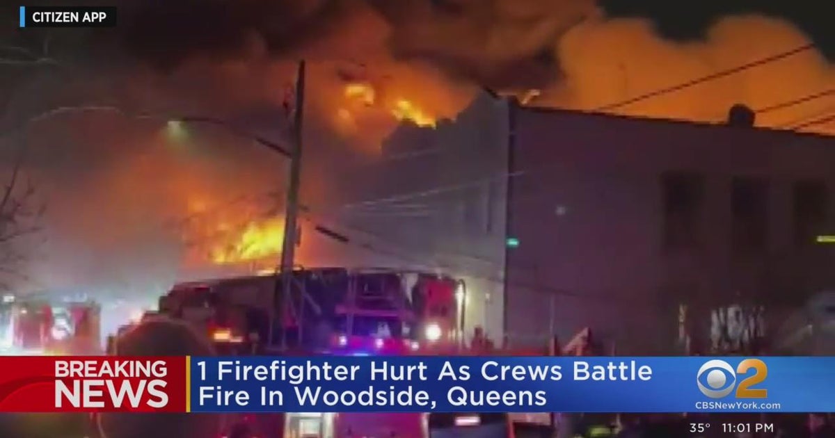1 firefighter hurt as crews battle fire in Woodside, Queens - CBS New York