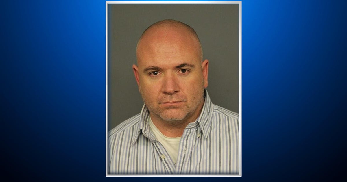 Denver police officer taken into custody on felony theft charges - CBS ...