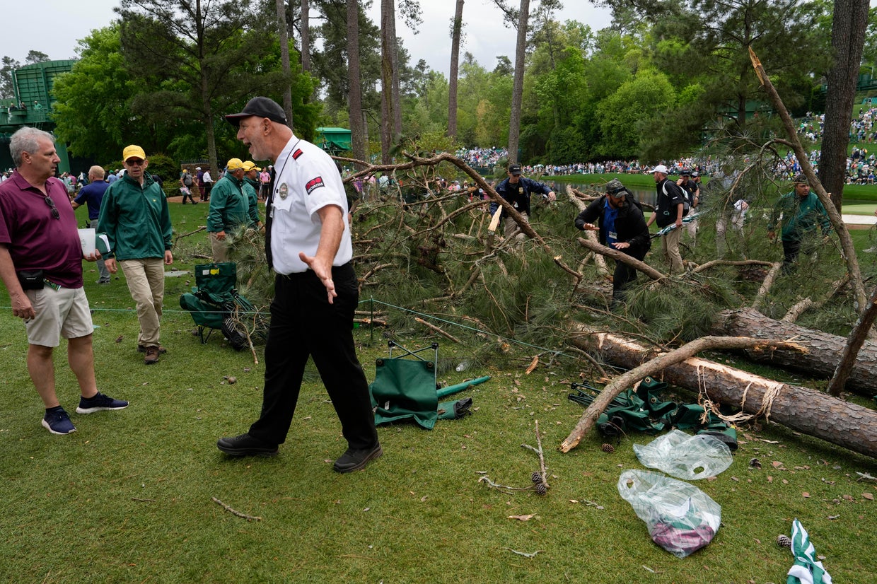 Storms bring down trees, bring play to halt at the Masters - CBS News