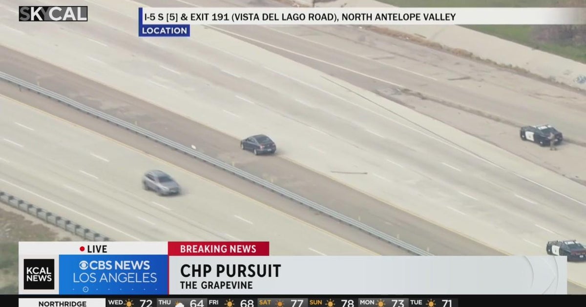 Pursuit suspect drives over spike strip on I-5 Freeway - CBS Los Angeles