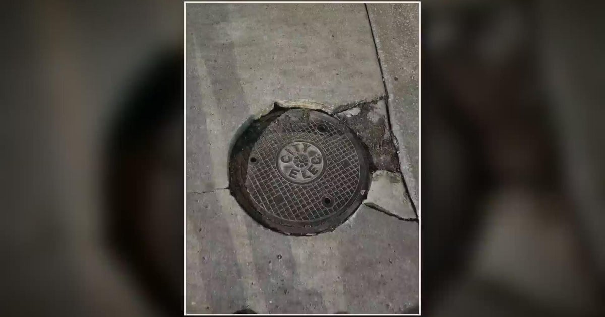 West Side residents upset with city over sinking manhole cover - CBS ...