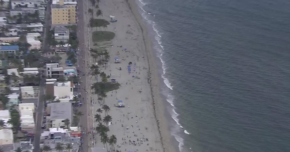 Watch: Waterspout comes ashore on Hollywood Beach - CBS Miami