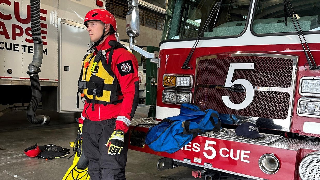 Aurora firefighter rescues man from rising creek waters - CBS Colorado
