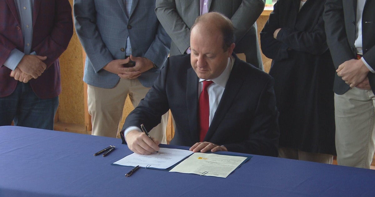Gov. Jared Polis signs wildfire bills into law - CBS Colorado