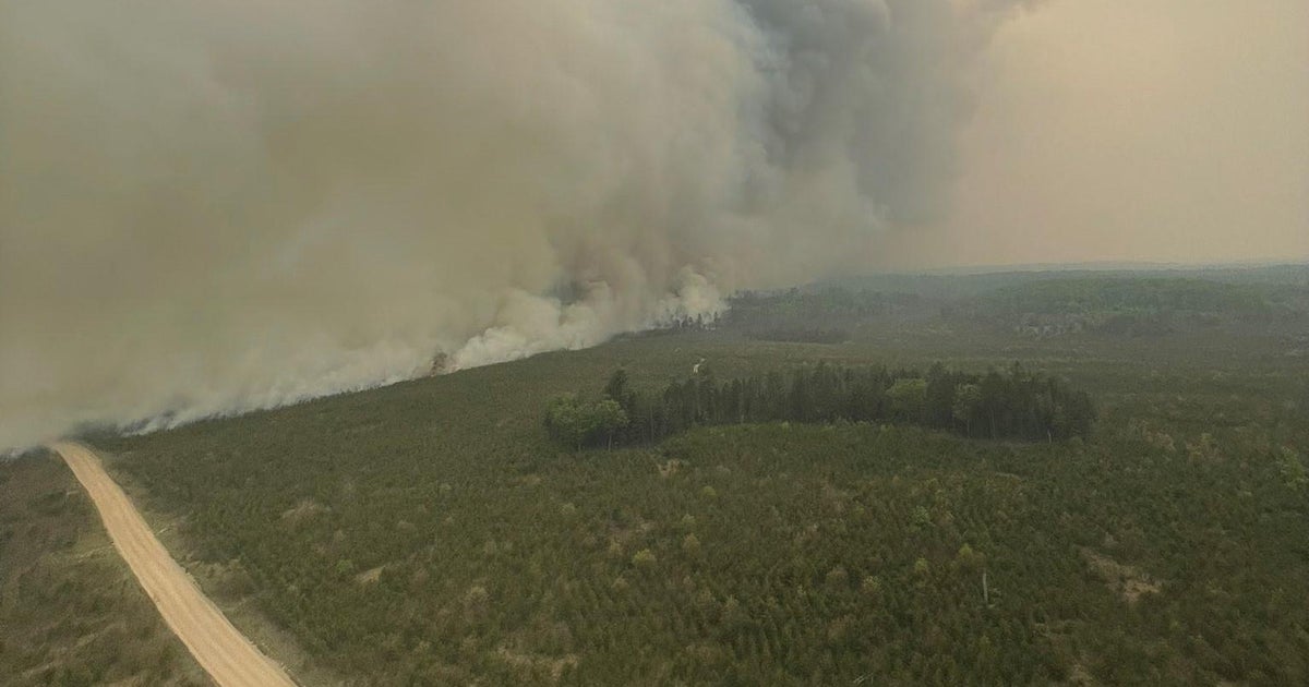 Northern Michigan wildfire burns through 3,600 acres, forcing ...