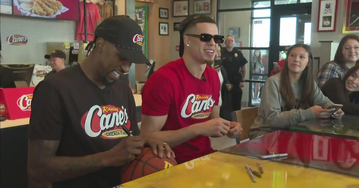 Nuggets players serve up lunch at Raising Cane's in Central Park - CBS ...
