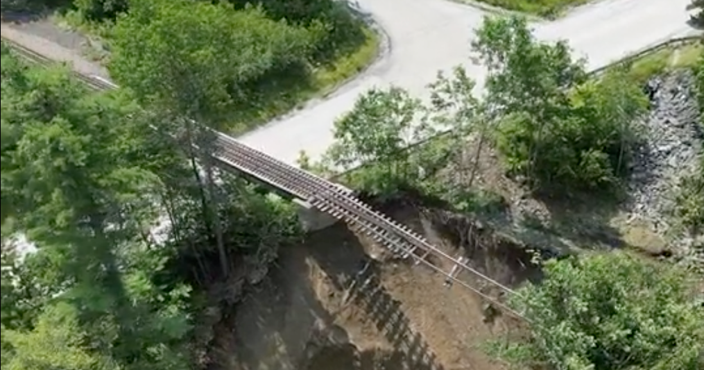 Vermont flooding leaves railroad track "dangling" mid-air over a gorge ...