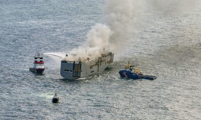 Deadly cargo ship fire still burning on vessel carrying 500 electric ...