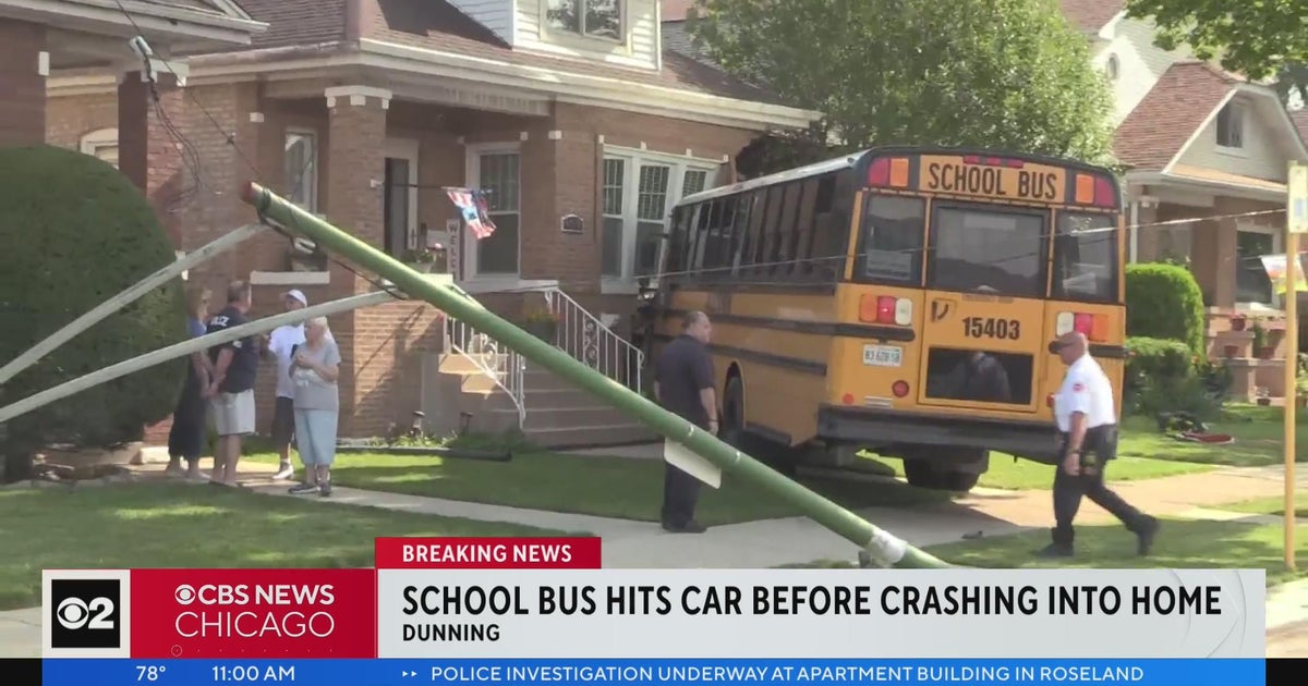 School bus hits car before crashing into home in Dunning - CBS Chicago