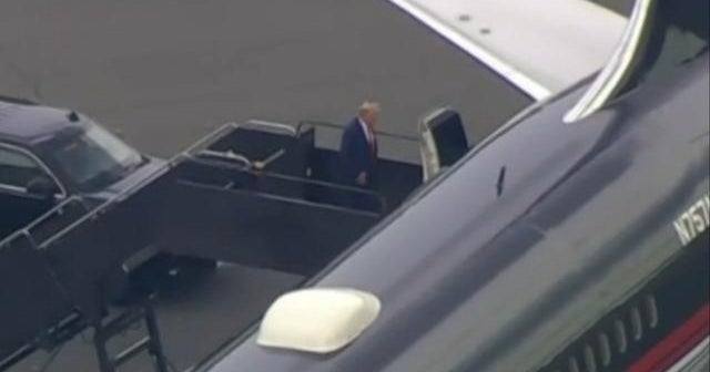 Trump boards plane for Washington to face arraignment - CBS News