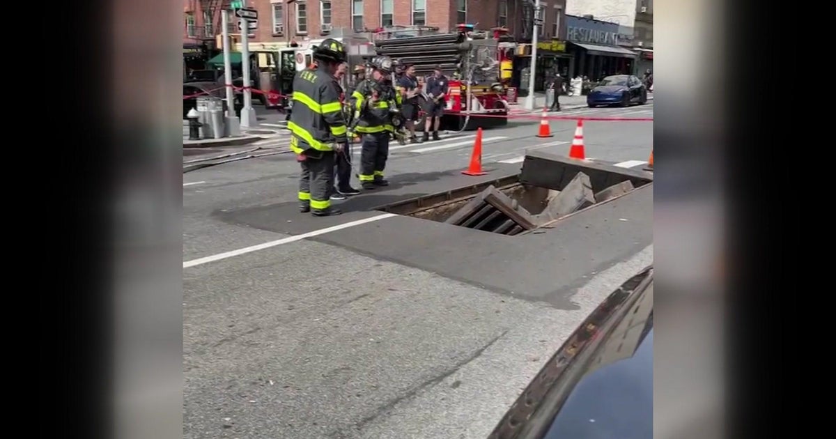 Section of road collapses in Chelsea after reports of manhole fire ...