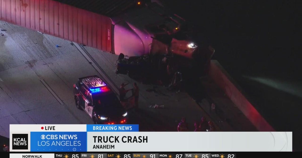 Semi truck overturns onto car on 57 Freeway in Anaheim - CBS Los Angeles