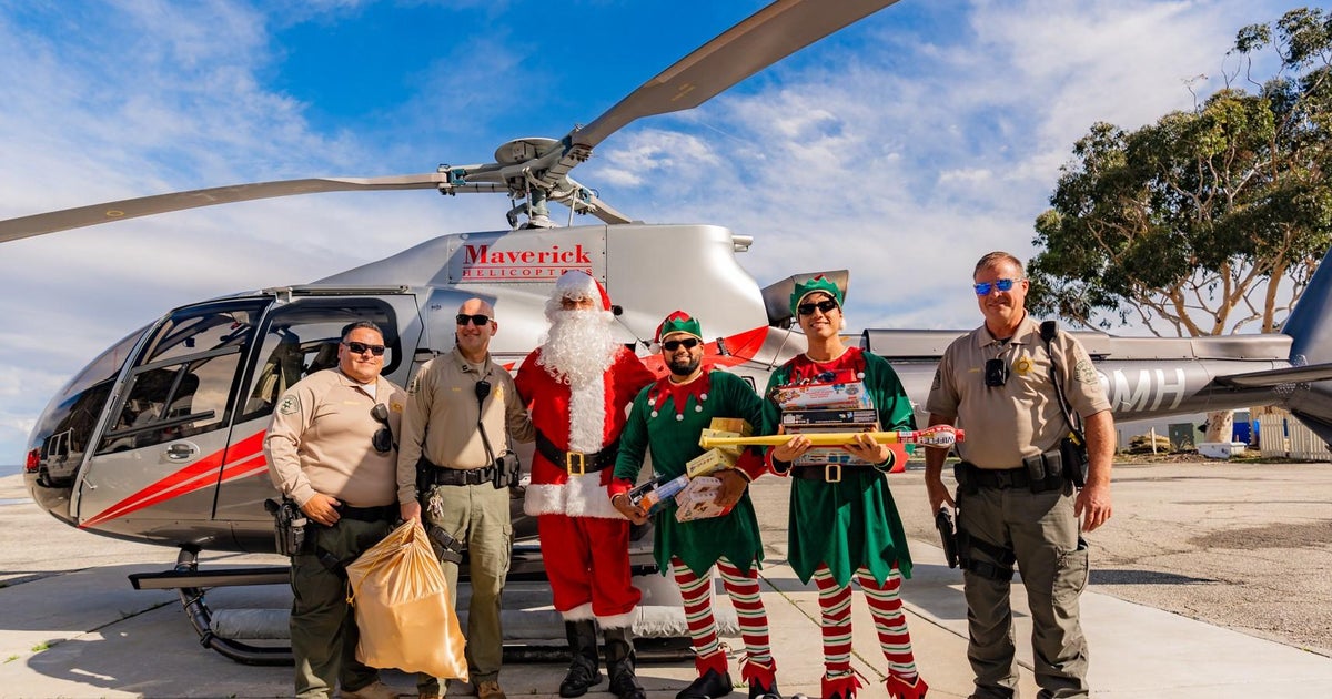 Santa flies by helicopter to Catalina Island with a load of toys - CBS ...