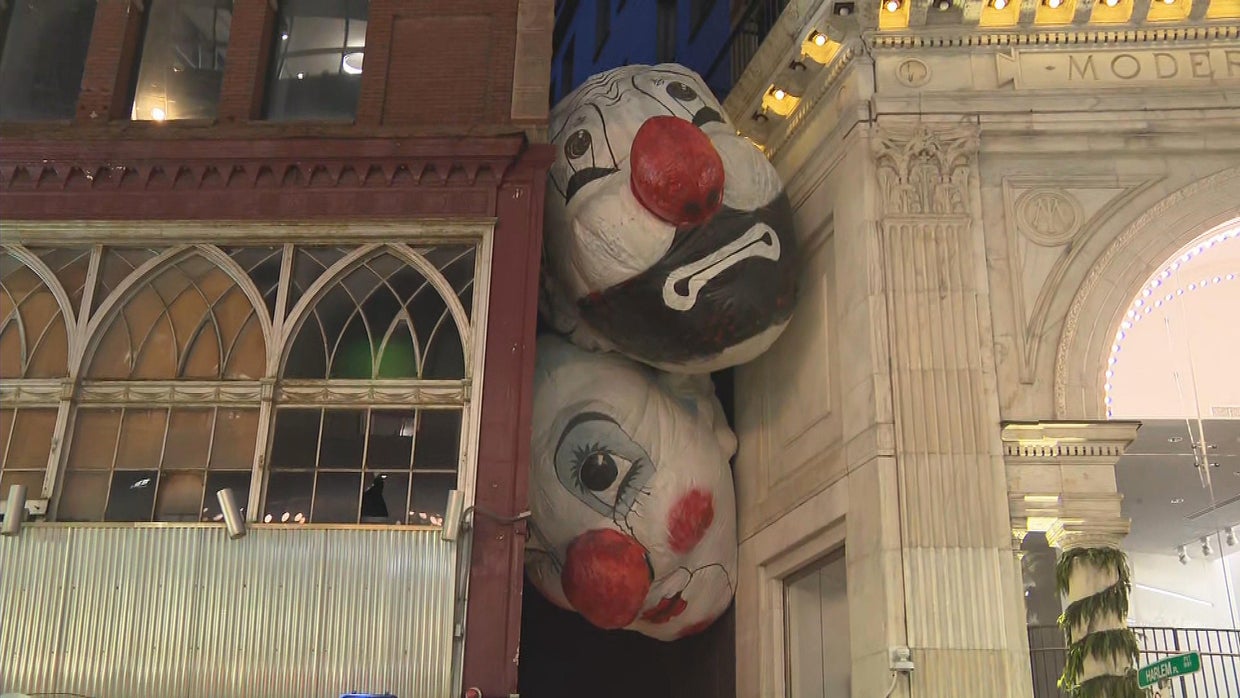 Giant clown heads are now hanging over an alley in downtown Boston ...