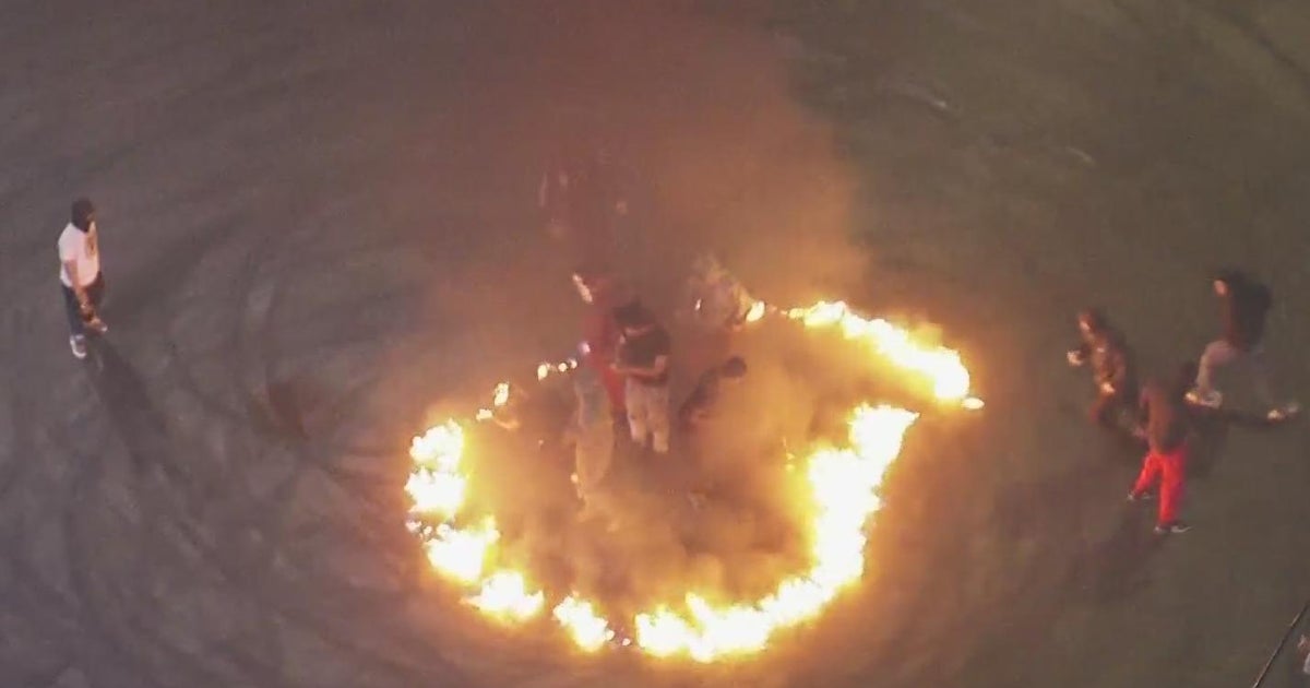 Watch: Oakland sideshow participants jump into burning ring of fire in ...