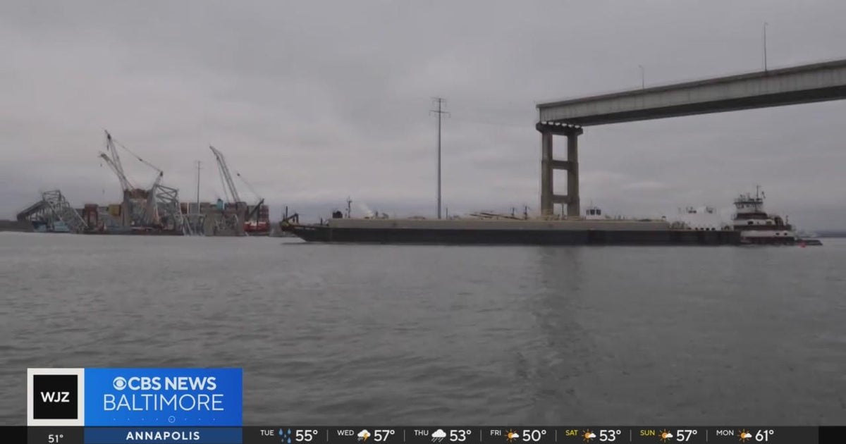 Vessel sails through Key Bridge collapse site marking big step - CBS ...