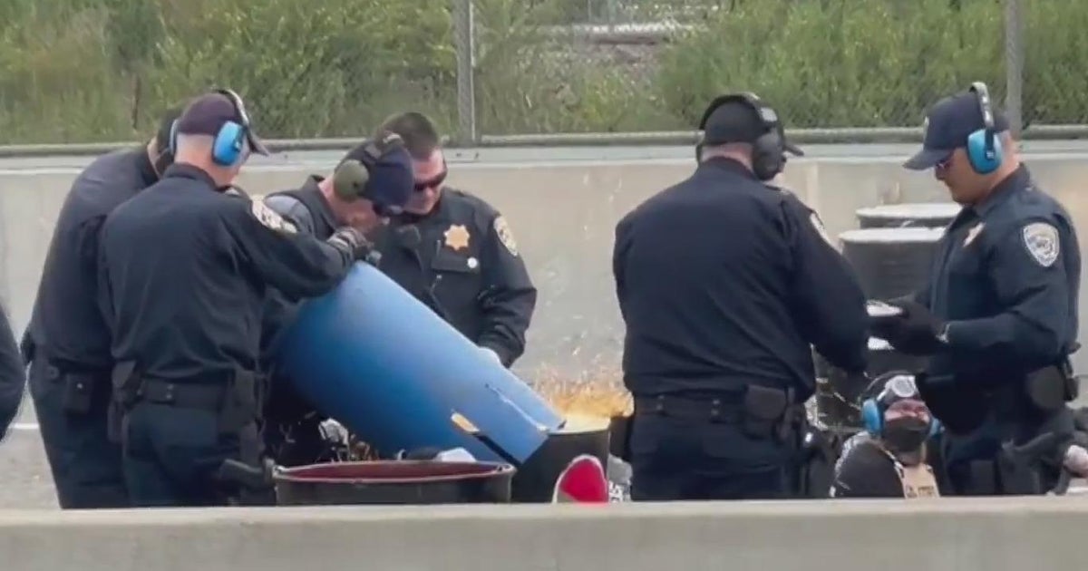 Oakland police and CHP working to clear protesters chained across ...