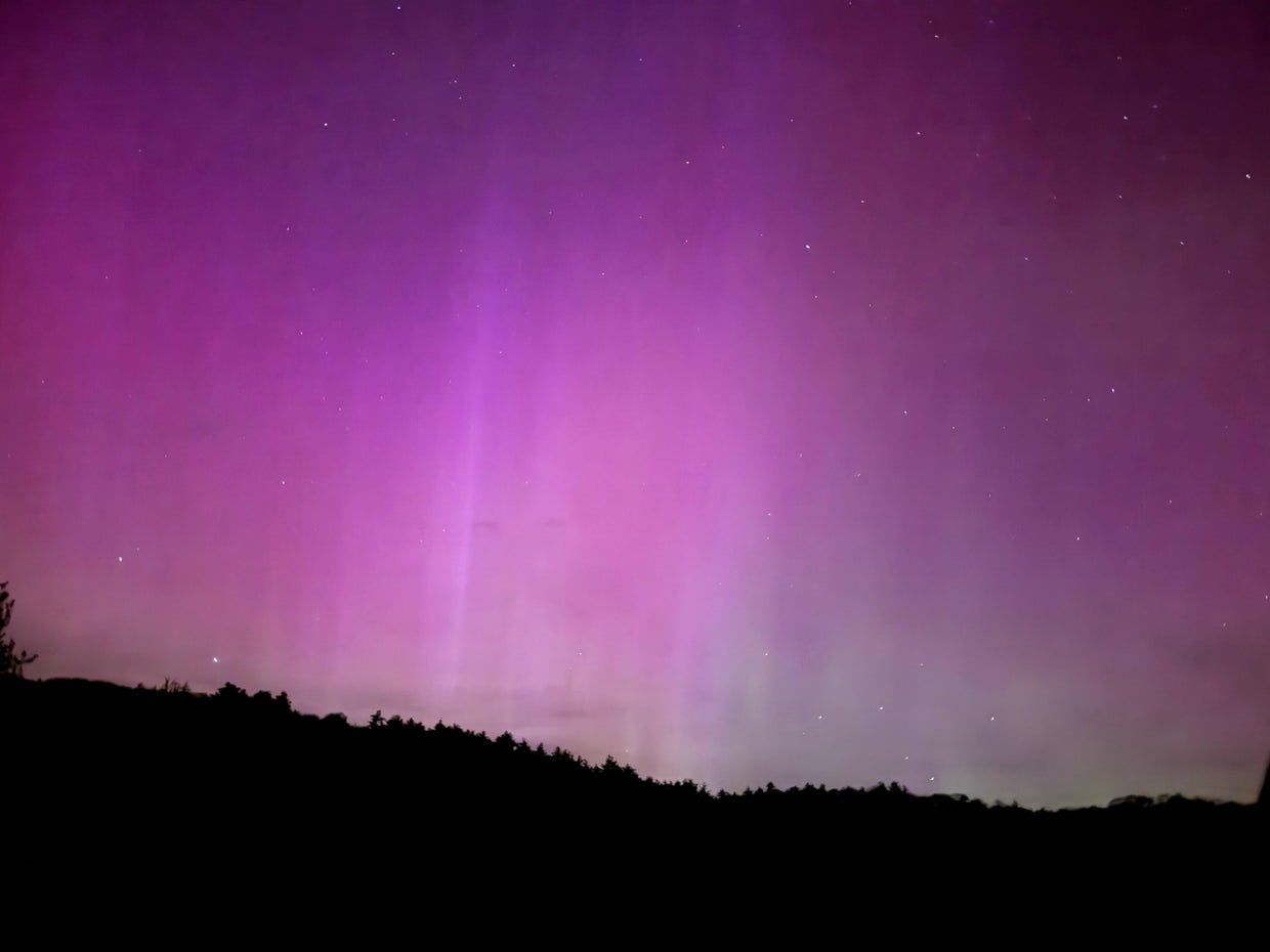 Photos show northern lights illuminating the sky around New England ...