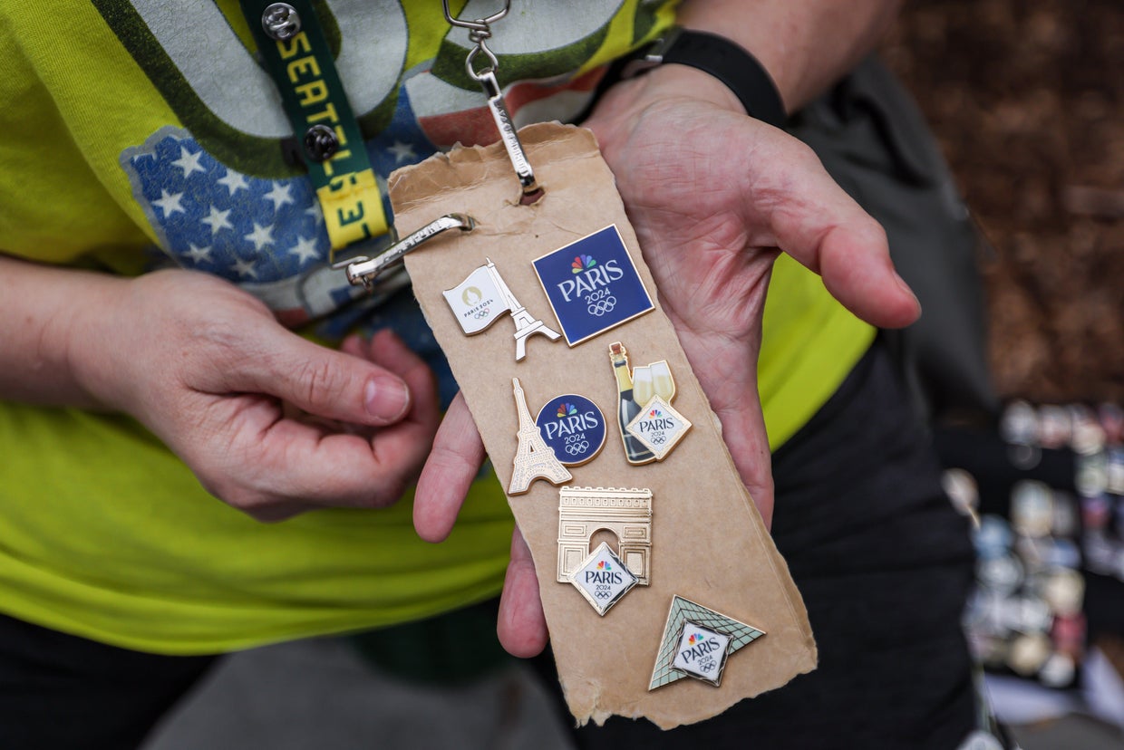 Olympic pin trading fever sweeps the 2024 Paris Games - CBS News