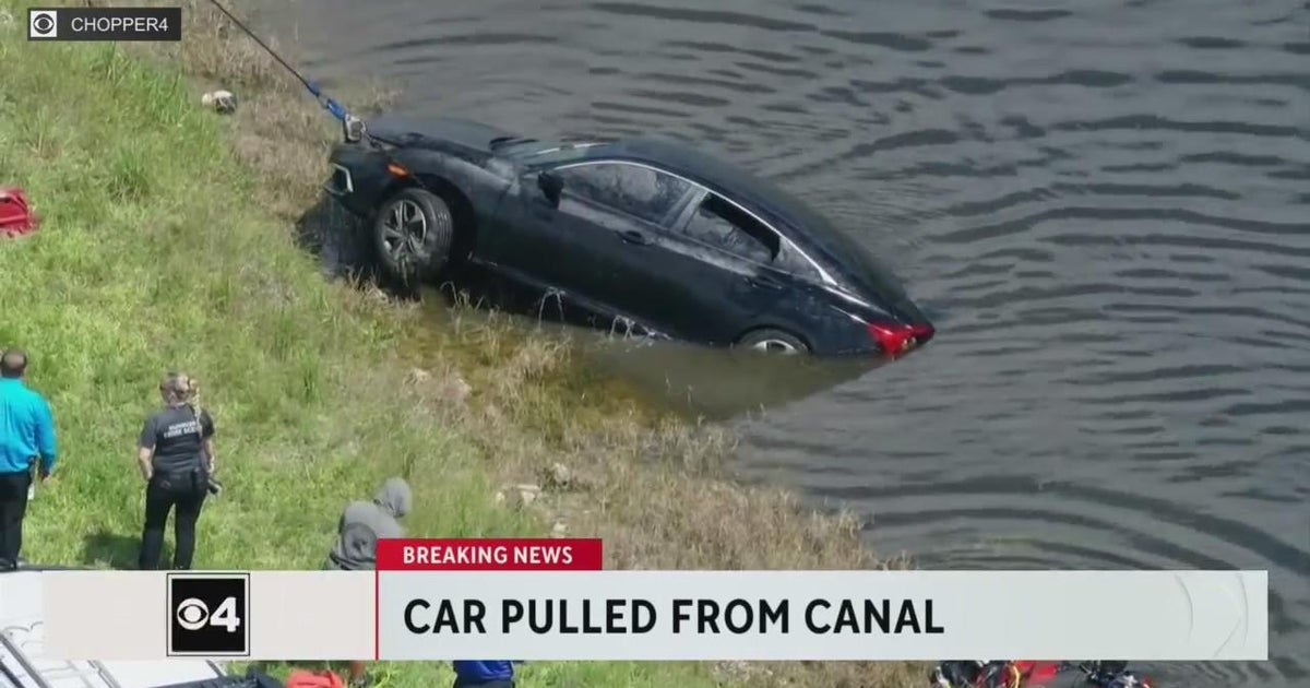 Body discovered in car pulled from Broward canal - CBS Miami