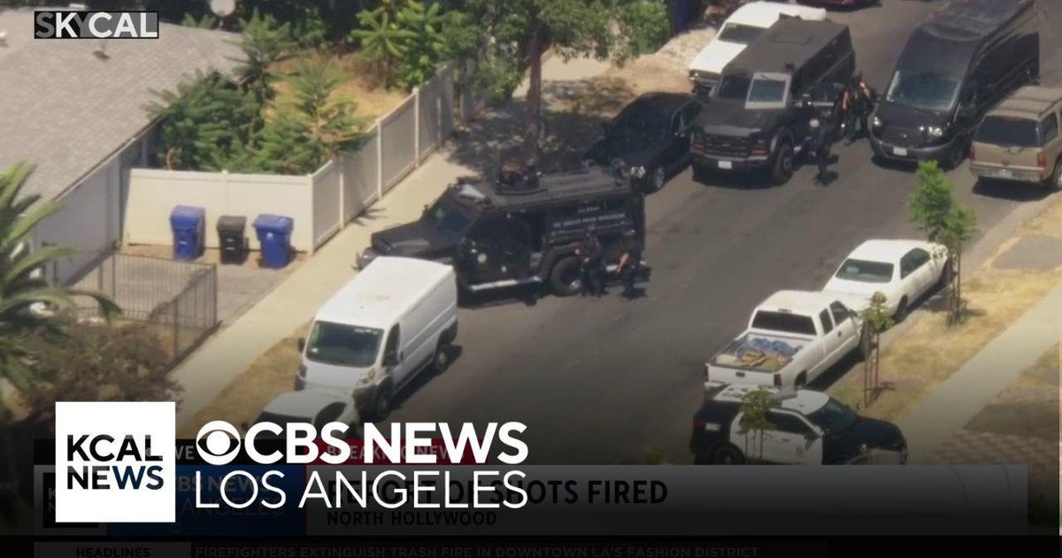 A suspect is in custody after shots were fired when LAPD officers ...