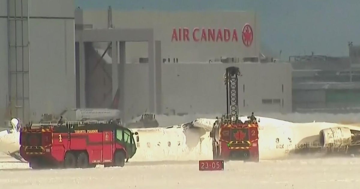 Delta plane overturns at Toronto Airport while landing - CBS Texas