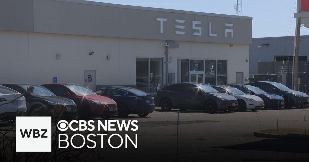 Dedham police investigate vandalism at Tesla dealership - CBS Boston