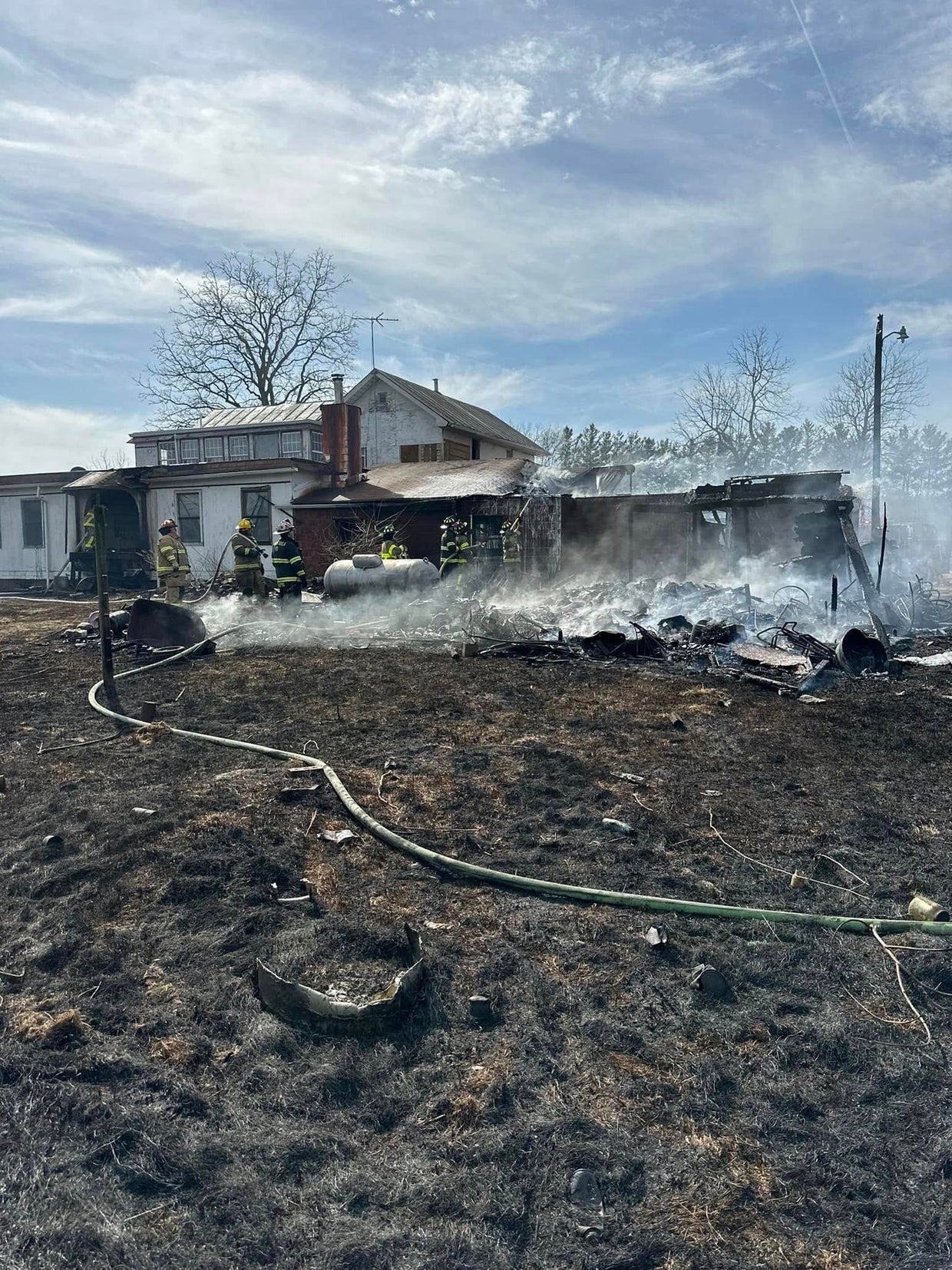 Wind-blown field fire near Dundee damages several buildings - CBS Detroit