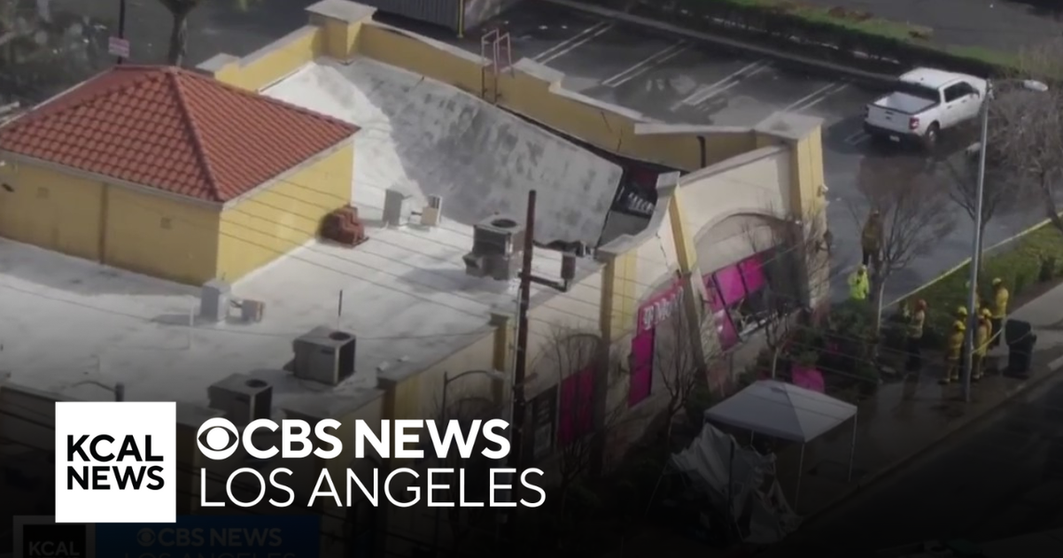 Water gushing from sheared hydrant makes T-Mobile building collapse in ...