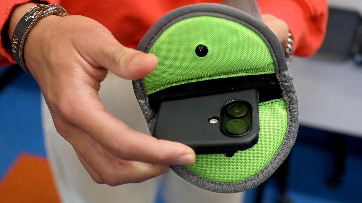 Schools across U.S. turn to a locked magnetic pouch as a cellphone ban ...