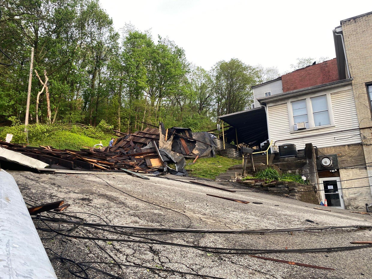 Photos show damaged buildings, downed trees after intense winds sweep ...