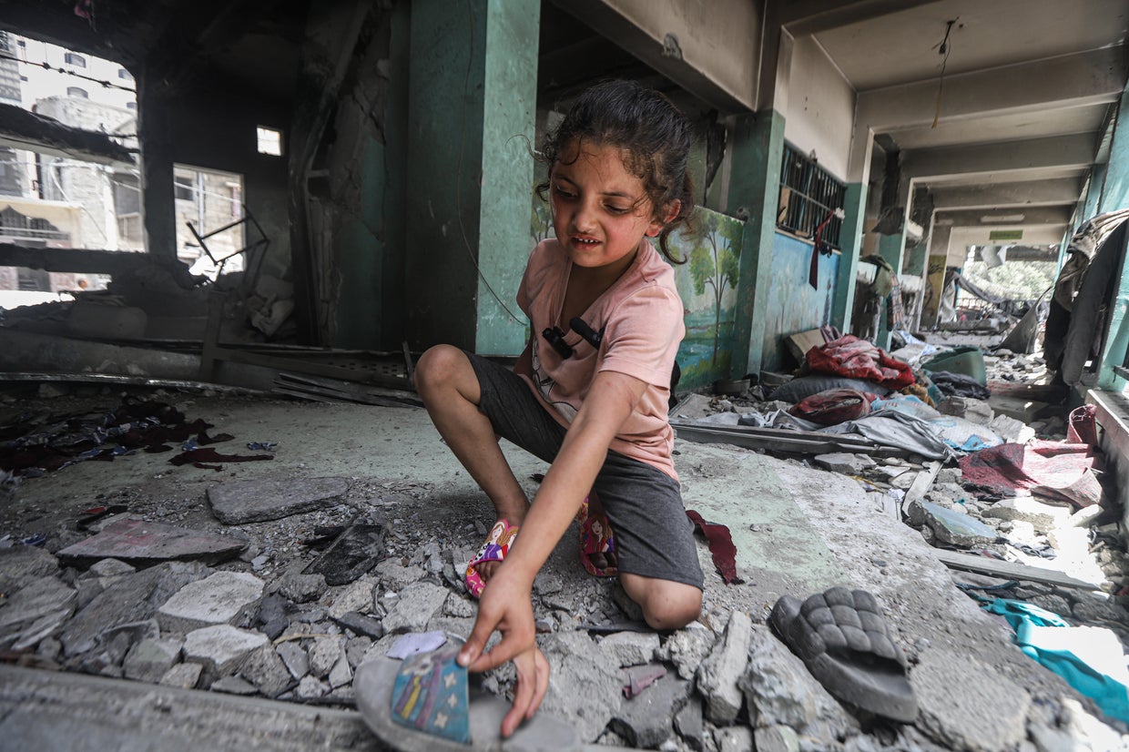 Tiny girl who emerged from flames of Israeli strike on Gaza school ...